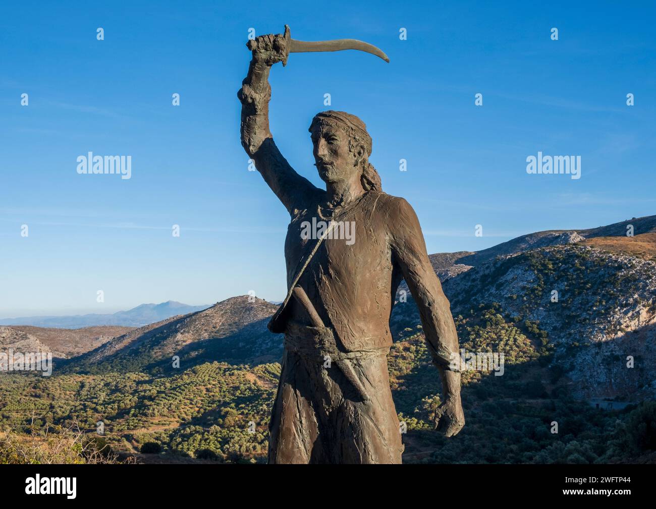 Statue of Cretan resistance fighte in mountain village of Gonies ...