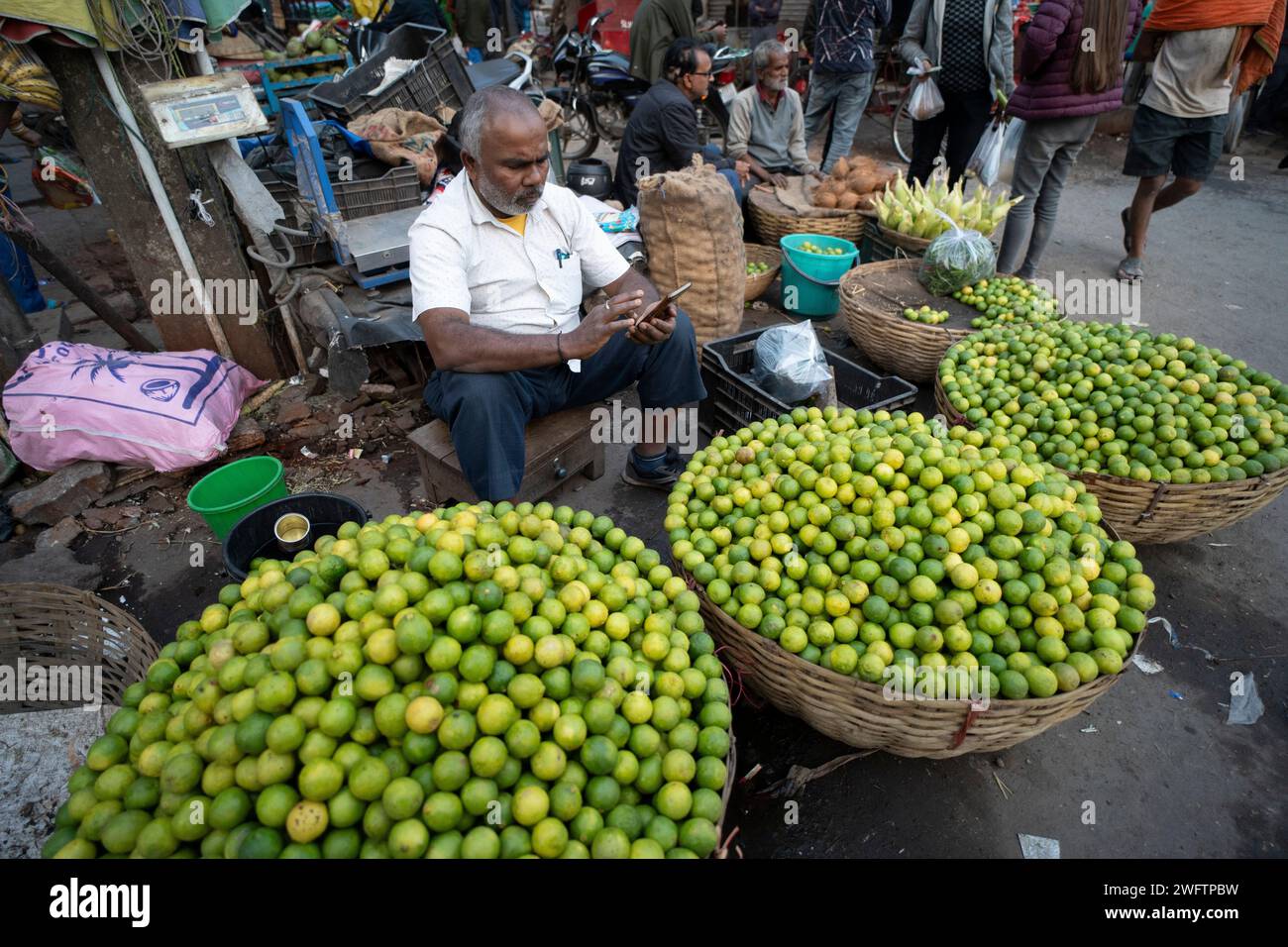 Vendor selling lemons at a market, ahead of the presentation of the ...