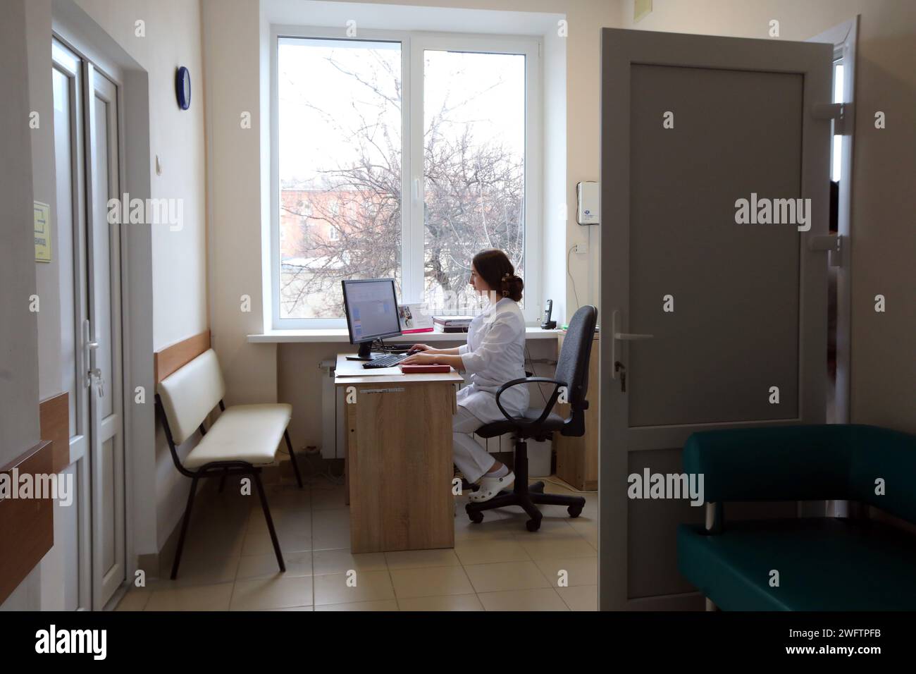 KHARKIV, UKRAINE - FEBRUARY 01, 2024 - A nurse works in the office of ...