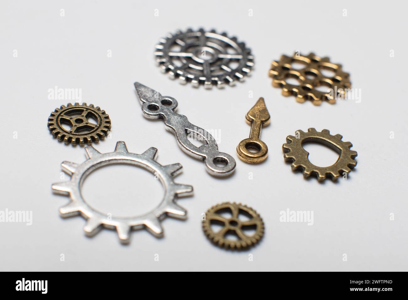 old clock parts isolate on white background Stock Photo - Alamy