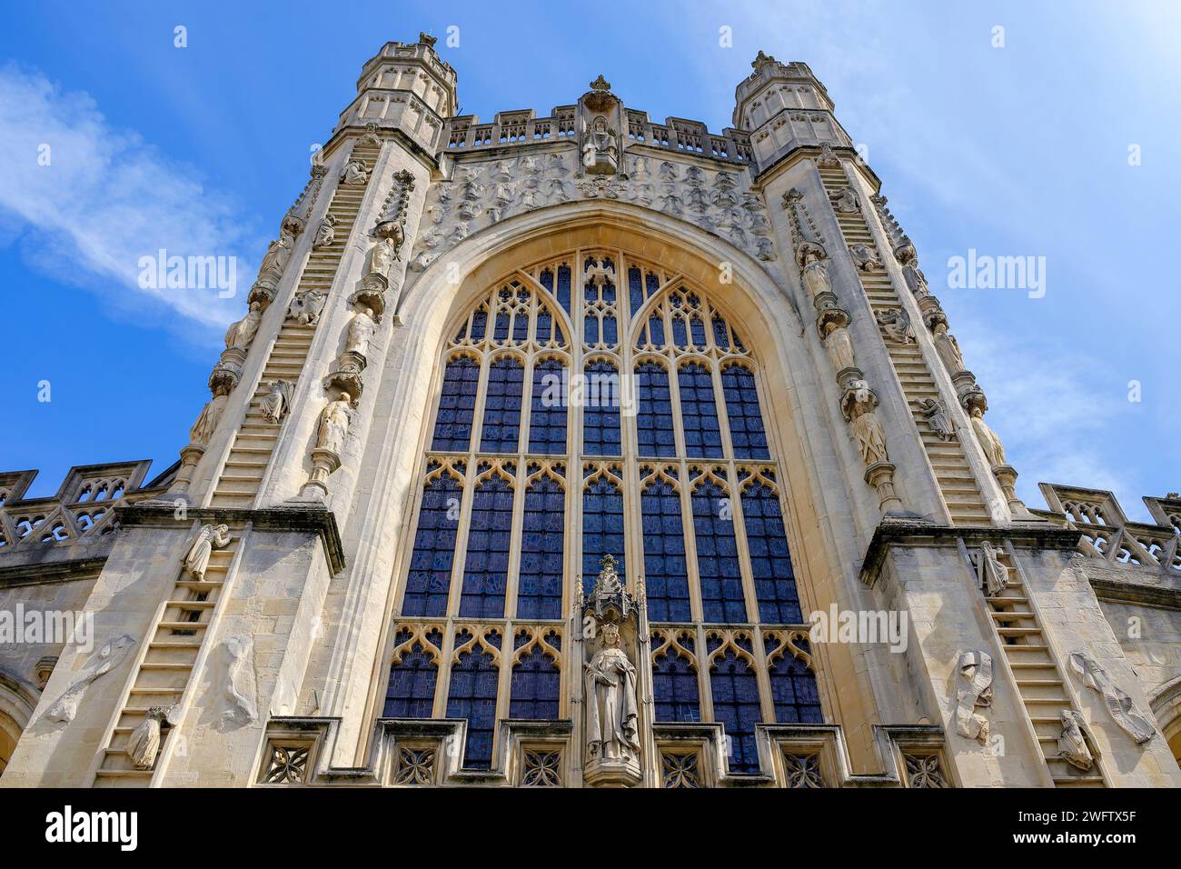 Pictured is the Western front of Bath Abbey showing intricate carvings ...