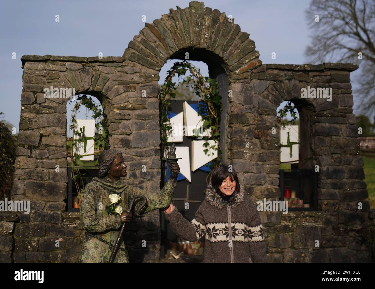Shauna Daviit, from Co. Wexford, touches a statue of St. Brigid at St ...
