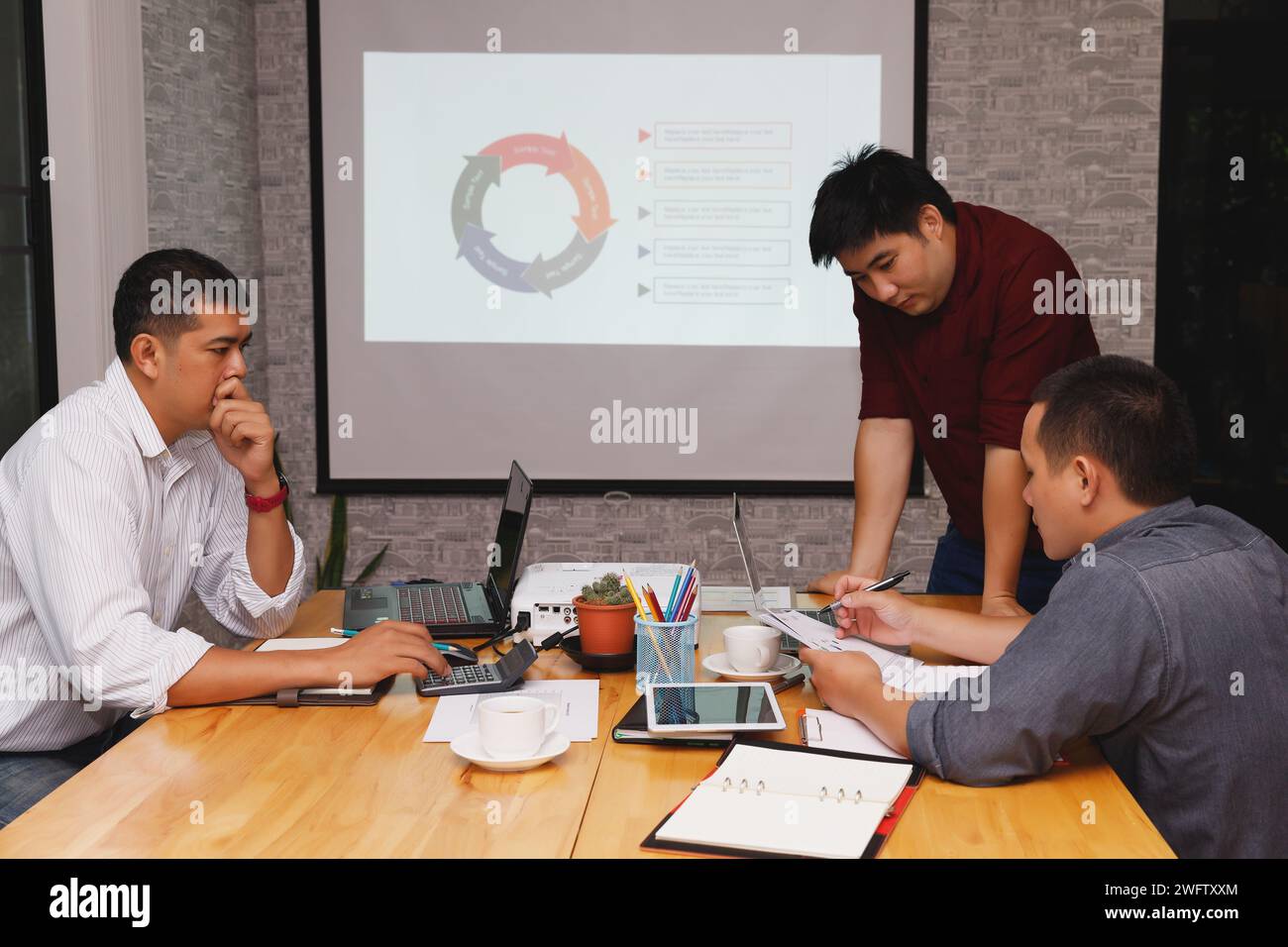 Business team meeting and discussing project plan. Businessmen ...