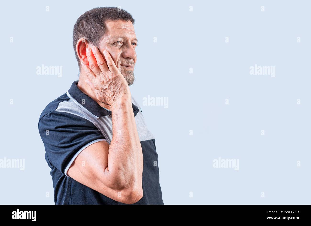 Senior man suffering from ear pain isolated. Person with otitis and ...