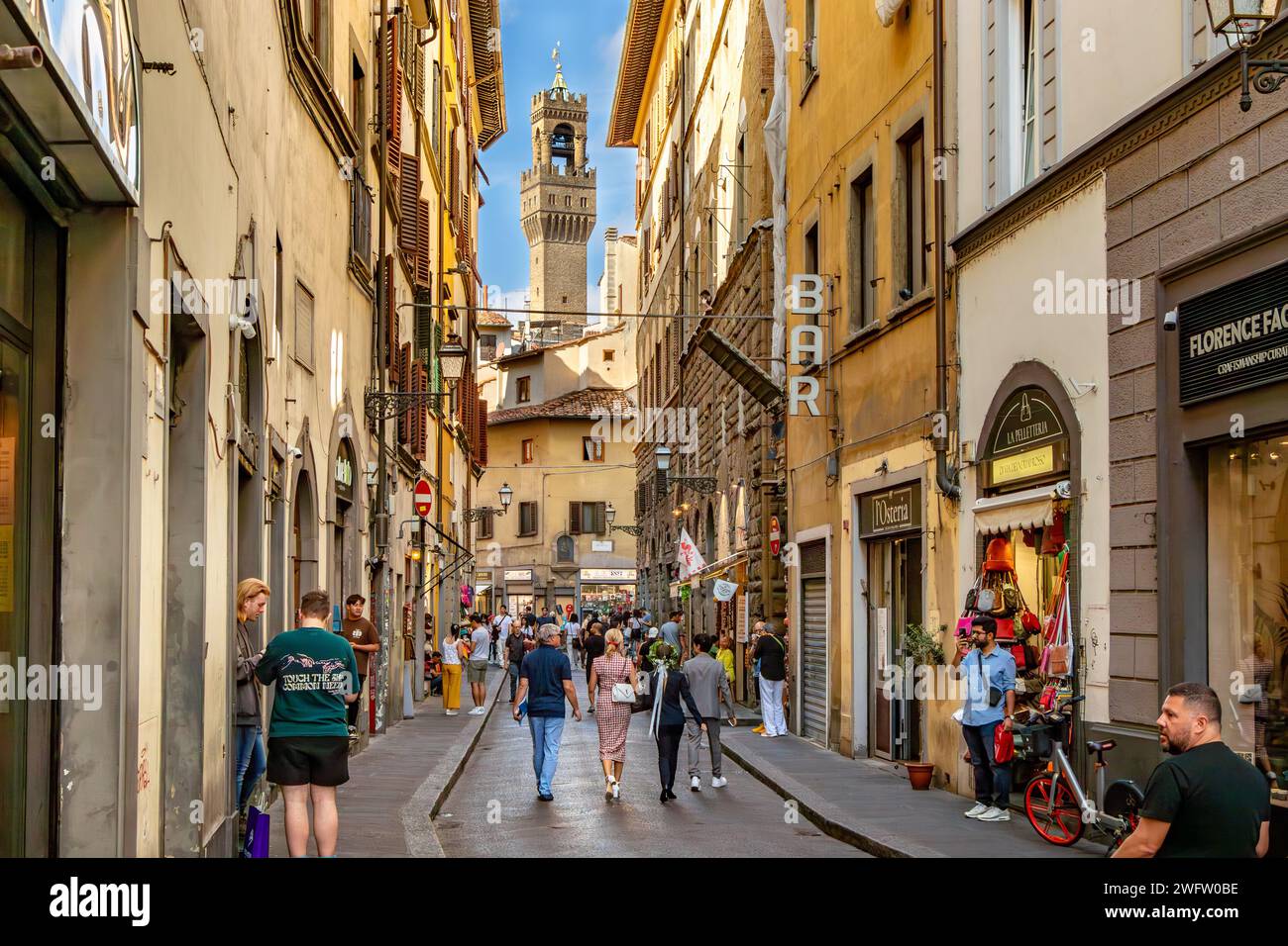 People walking along Via dei Neri,a street in Florence with the Palazzo ...