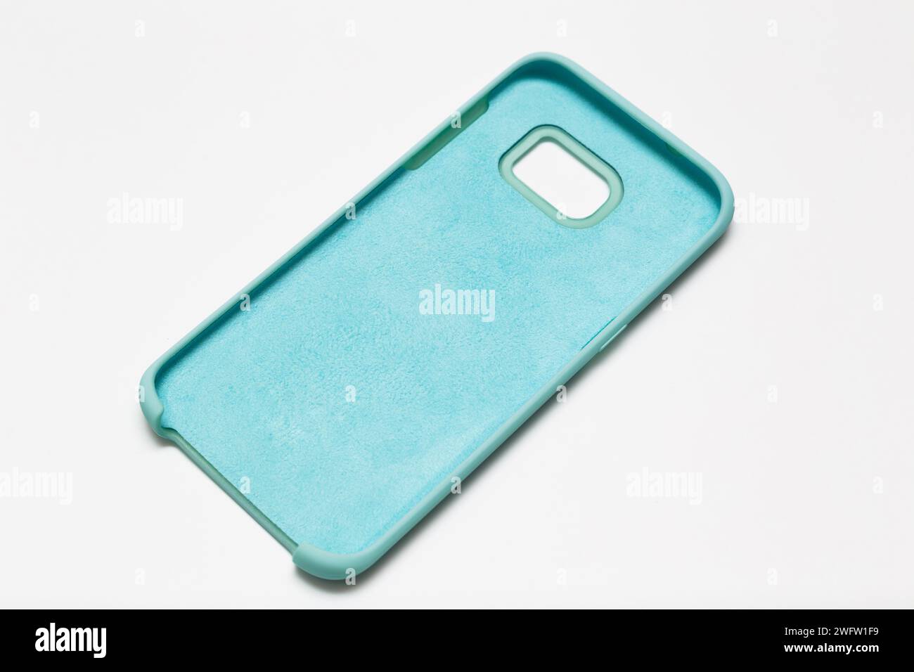 Beautiful soft pastel mint color mobile phone case isolated on white ...