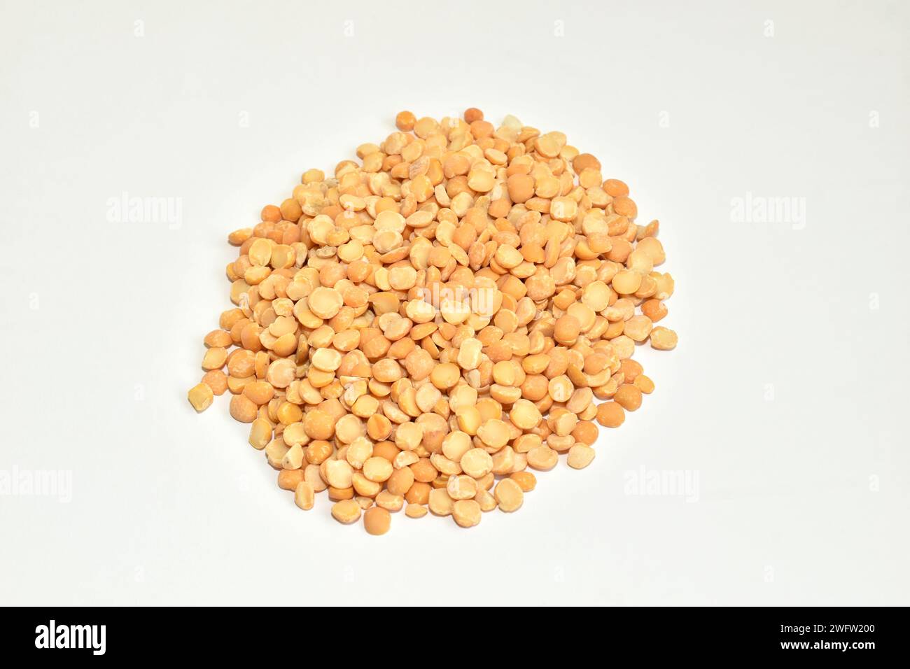 Peeled and dried pea seeds lie in a pile on a white background Stock ...