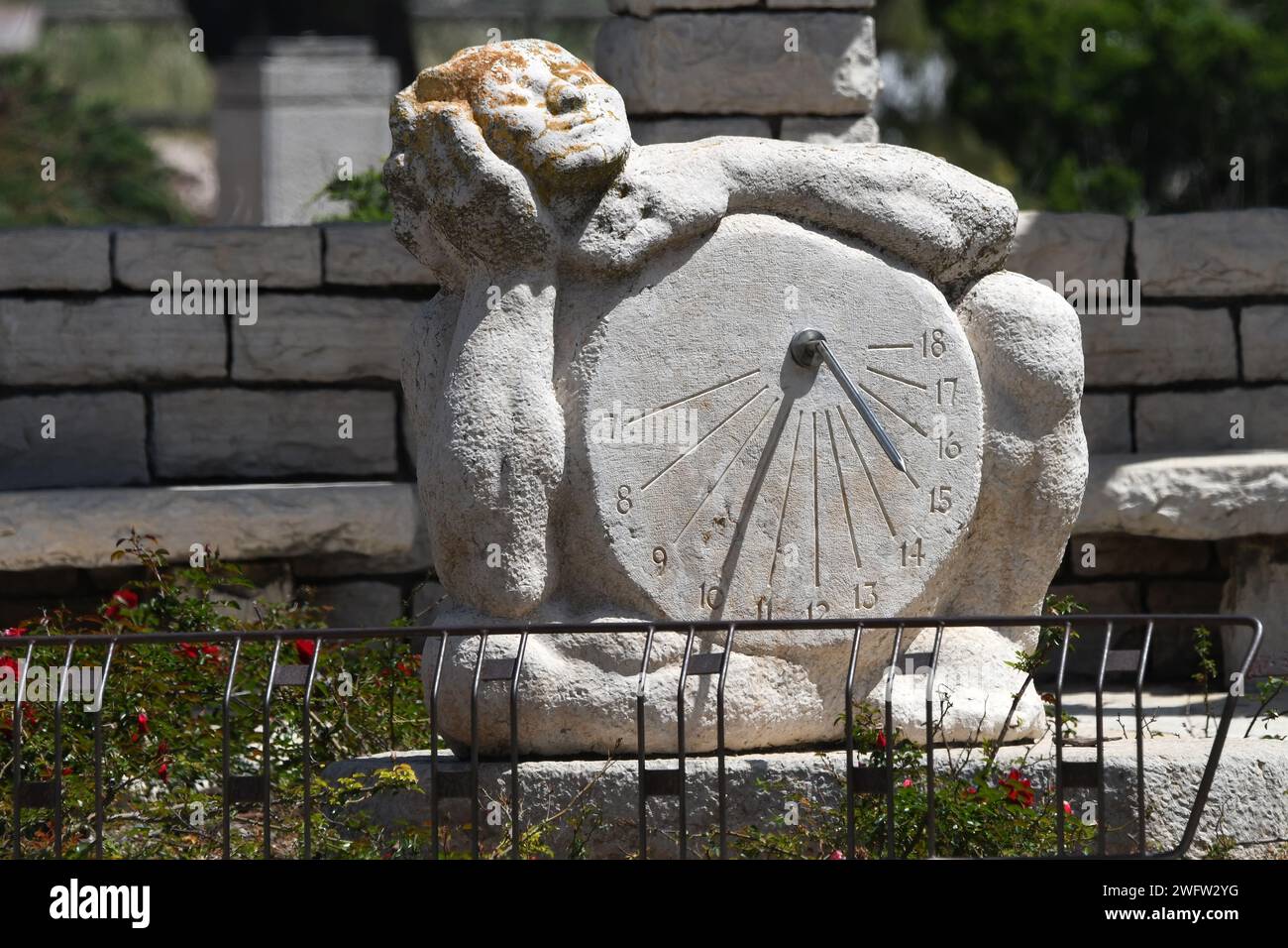 A Sundial on a Stone statue Stock Photo - Alamy