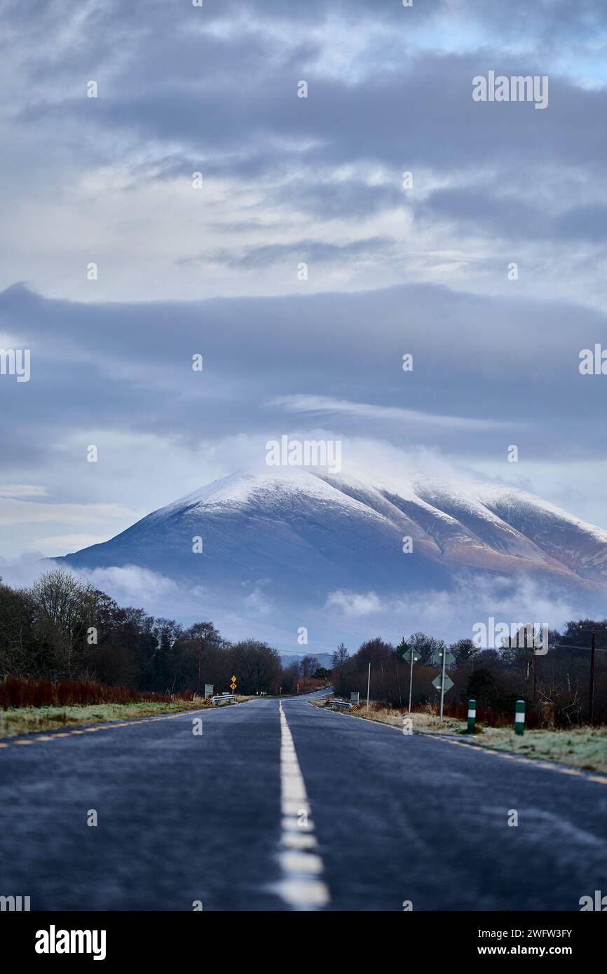 Snow on Nephin mountain dramatic sky low clouds Ireland Stock Photo - Alamy