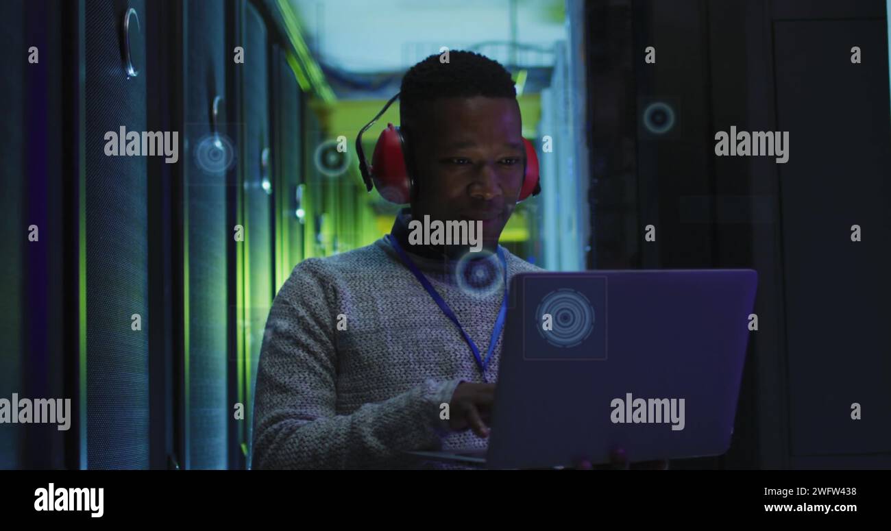 Image of processing circles over african american man working in server ...