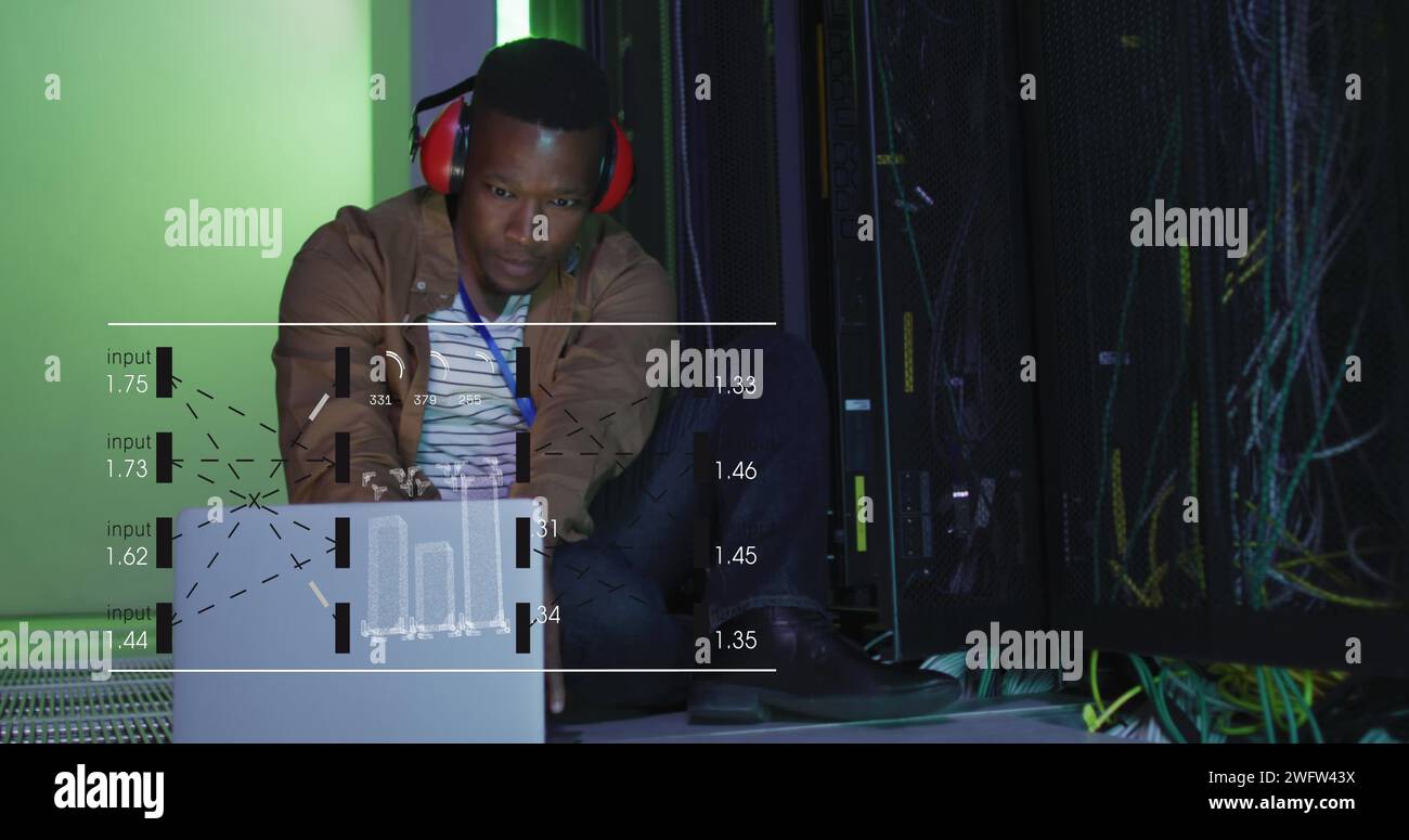 Image of data processing on screens over african american man working ...
