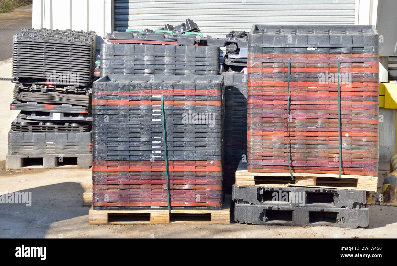 Huge piles of different type of pallet at a recycling business area ...
