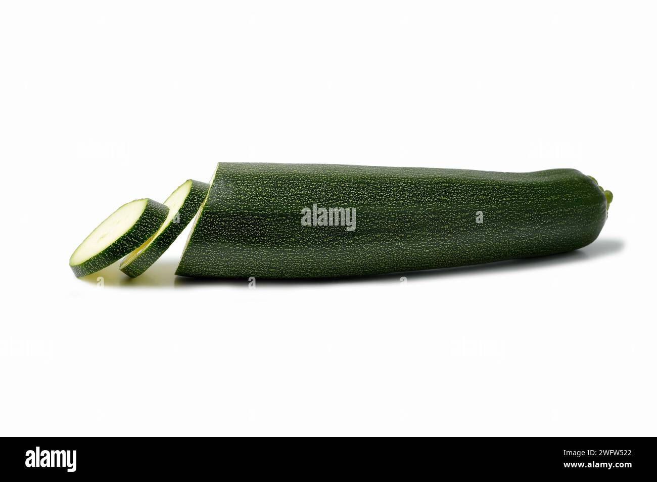 View of a fresh sliced cucumber isolated on white Stock Photo - Alamy
