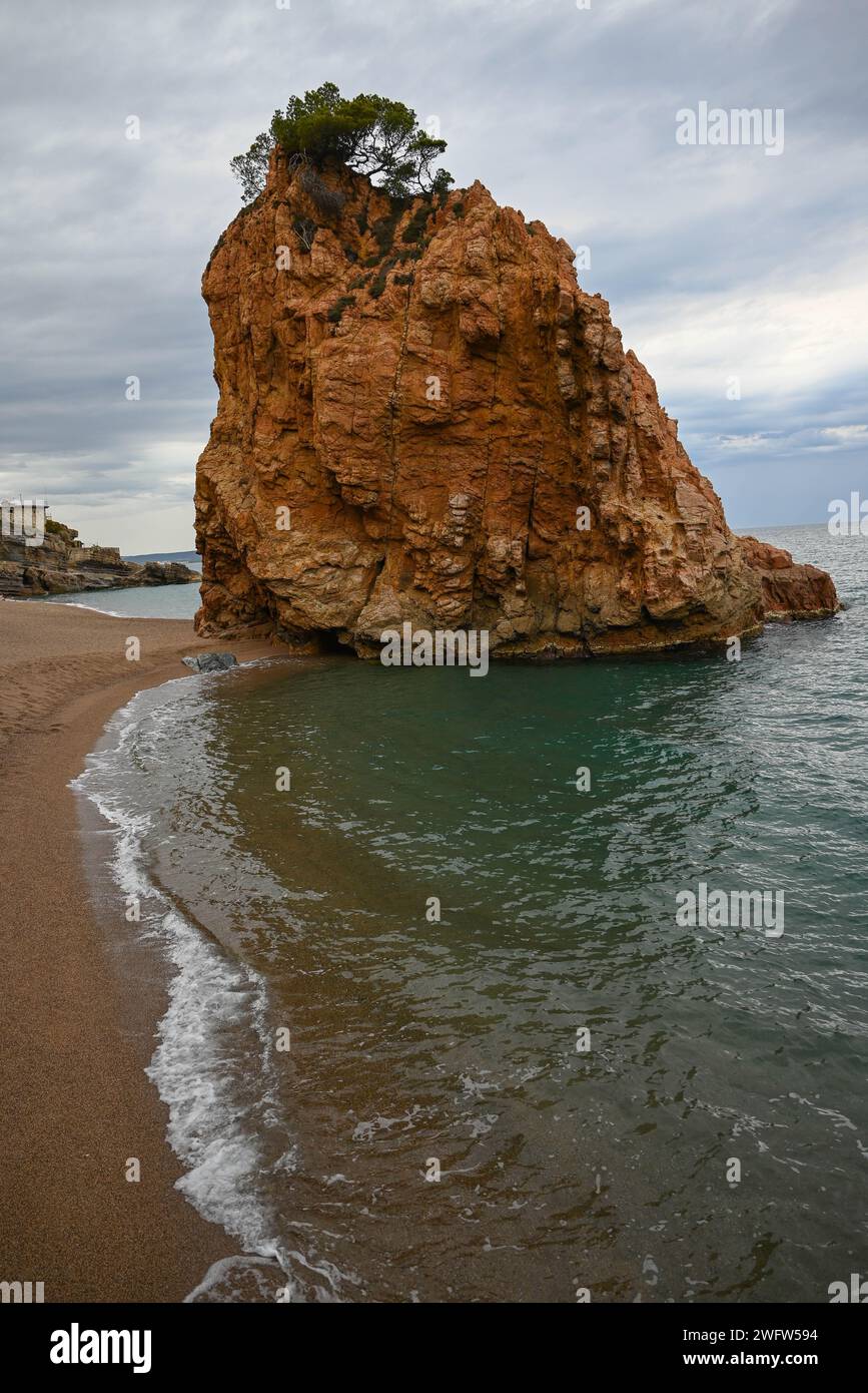 A stunning beach view with the Illa Roja rock formation Stock Photo - Alamy