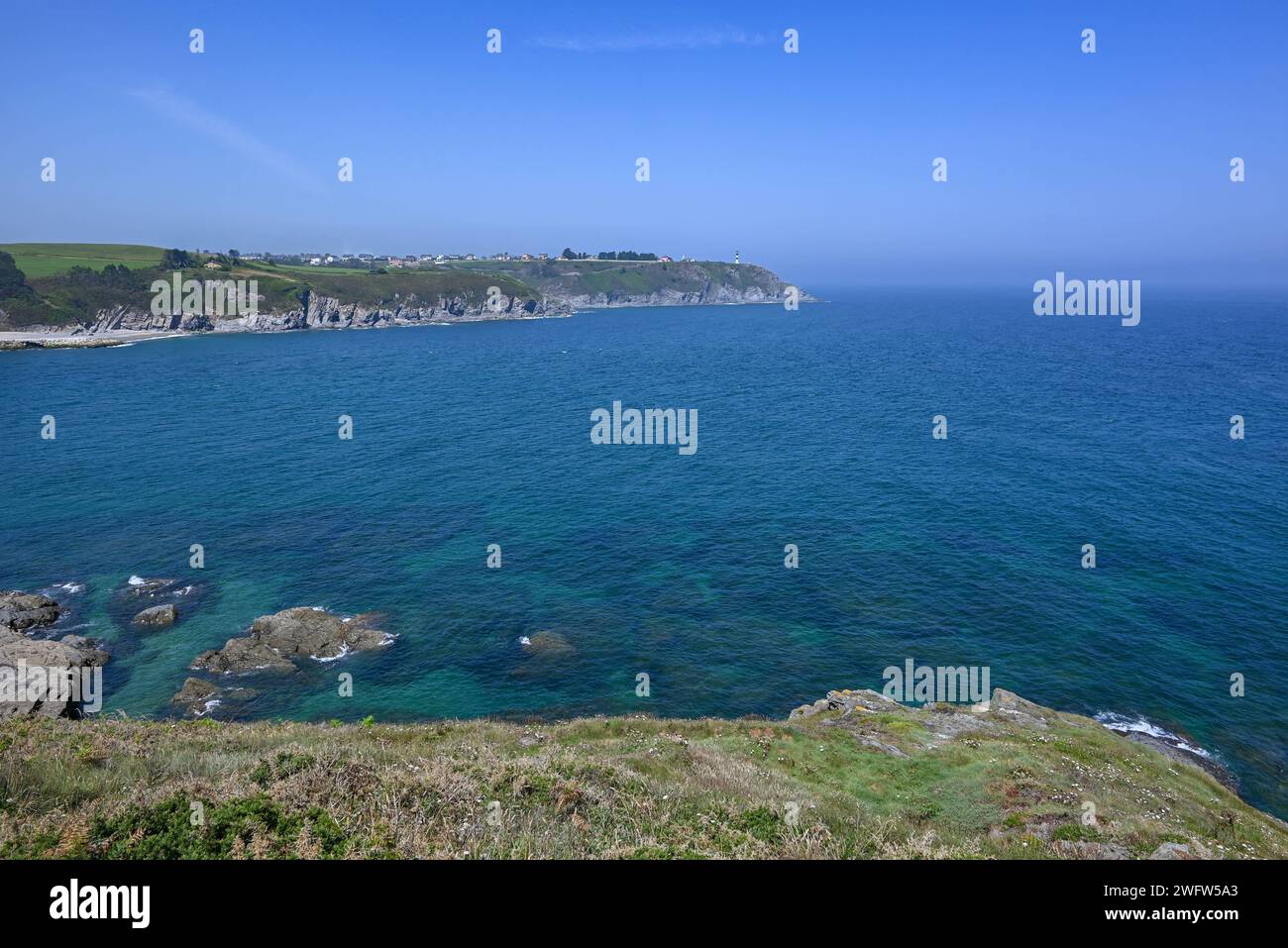 An aerial view of ocean waters with numerous rocky formations in Navia ...