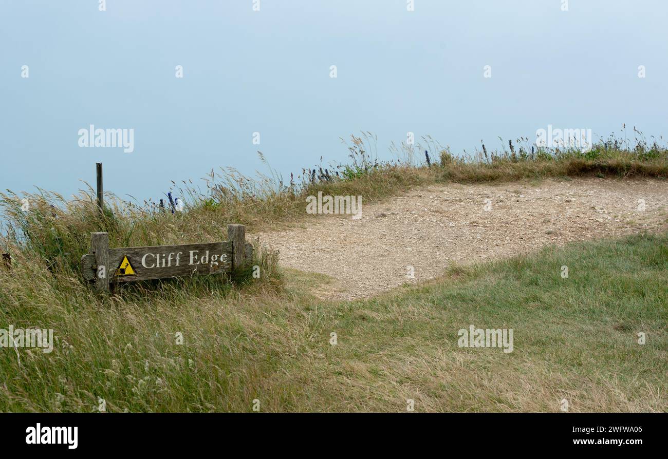 Cliff edge warning sign. Caution crumbling slope. Risk of injury or ...