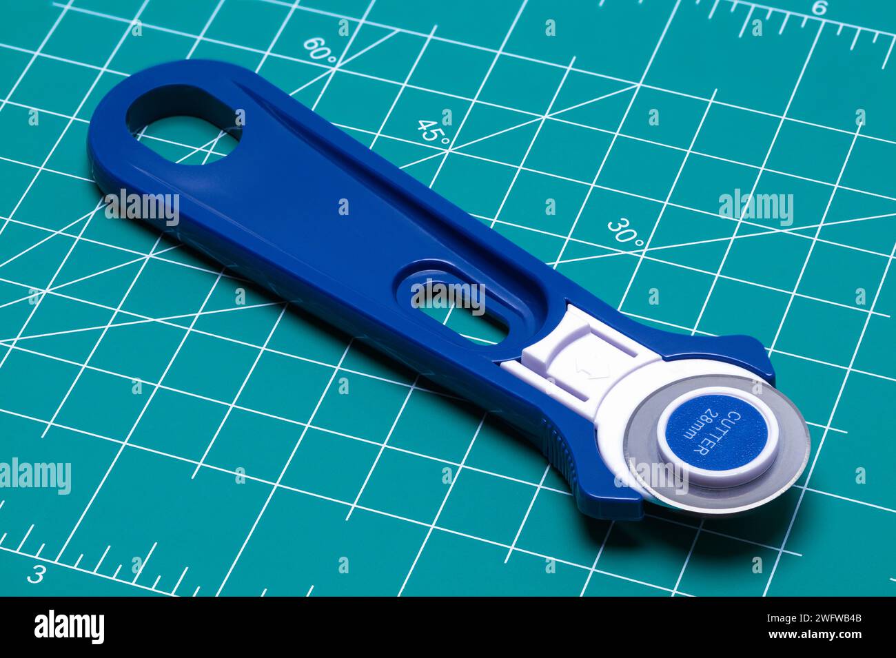 Fabric Rotary Cutter Cut Out on White Stock Photo - Alamy