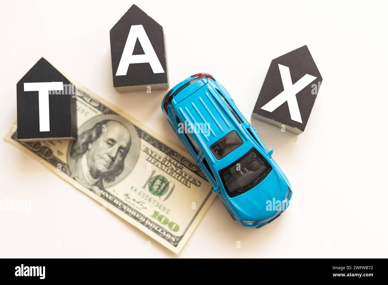 Tax text in wooden cubes and tax or vat form documents to complete ...
