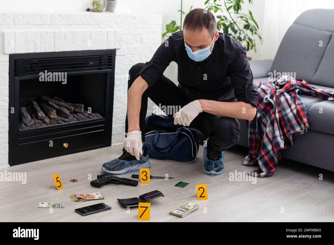 Crime scene investigation - collecting pistol and cartridges by ...