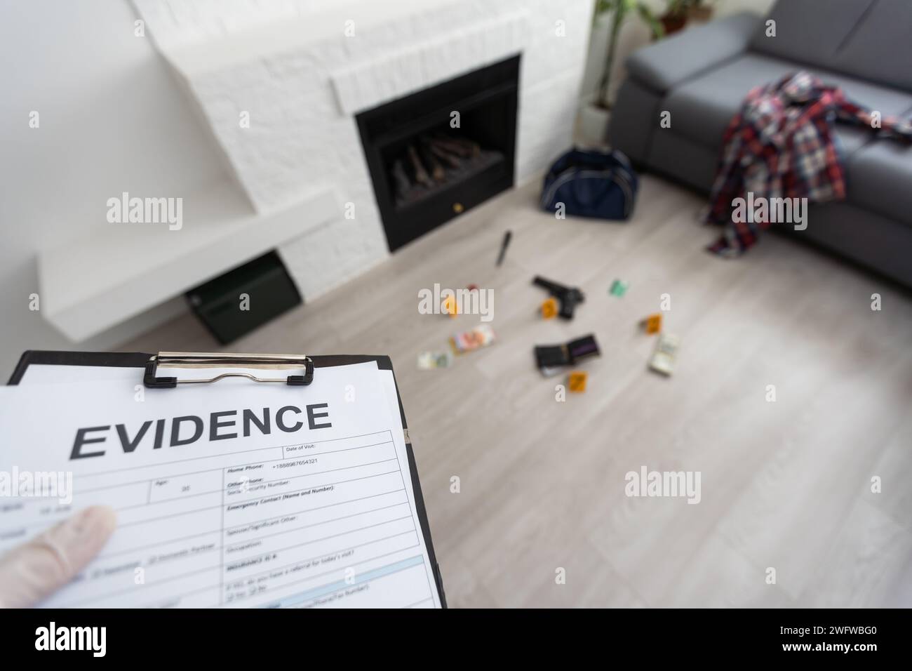 forensic 's hand in black glove writing on evidence bag and seal by red ...