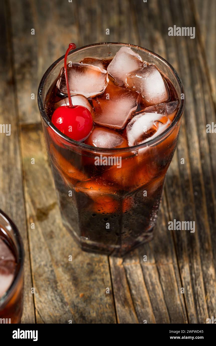 Cold Refreshing Cherry Cola with Ice in a Glass Stock Photo - Alamy