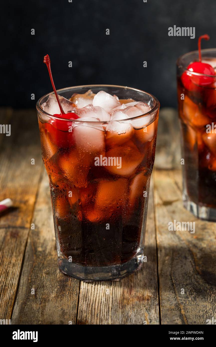 Cold Refreshing Cherry Cola with Ice in a Glass Stock Photo - Alamy