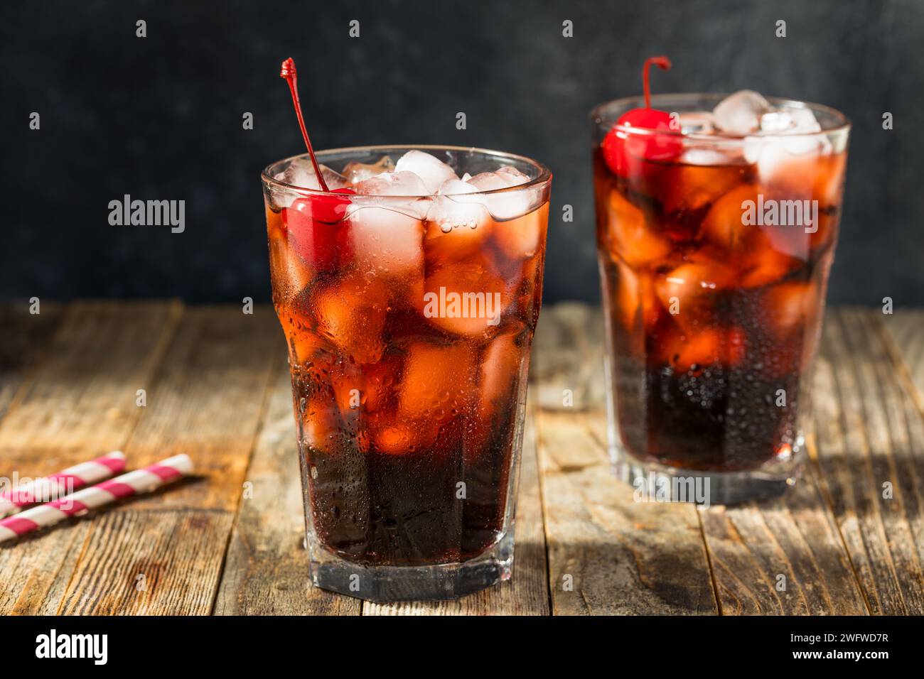 Cold Refreshing Cherry Cola with Ice in a Glass Stock Photo - Alamy
