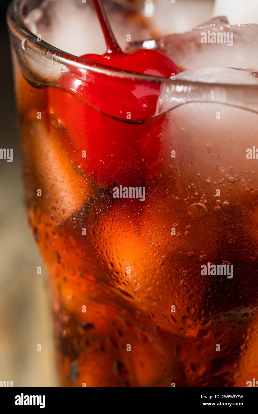 Cold Refreshing Cherry Cola with Ice in a Glass Stock Photo - Alamy
