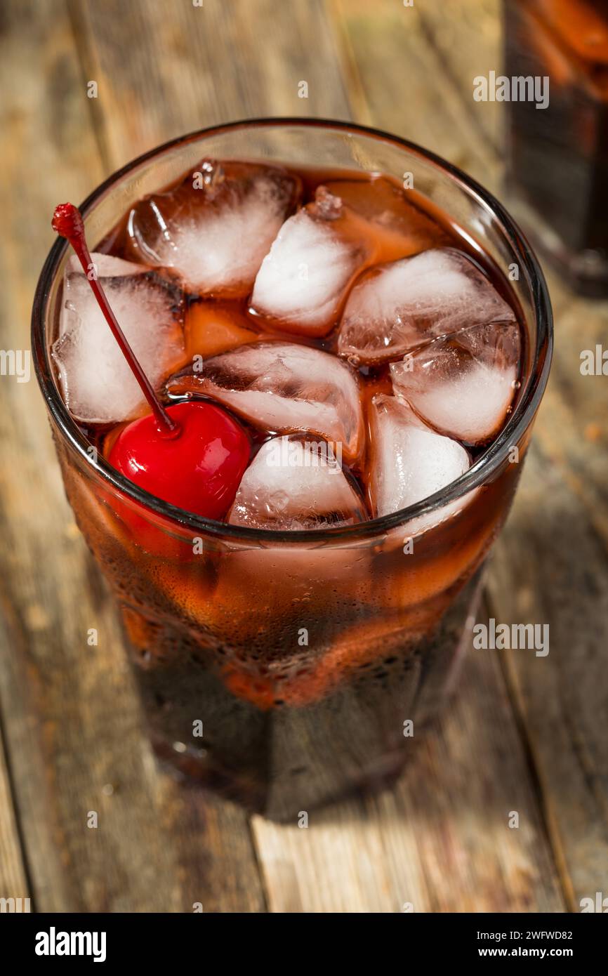 Cold Refreshing Cherry Cola with Ice in a Glass Stock Photo - Alamy