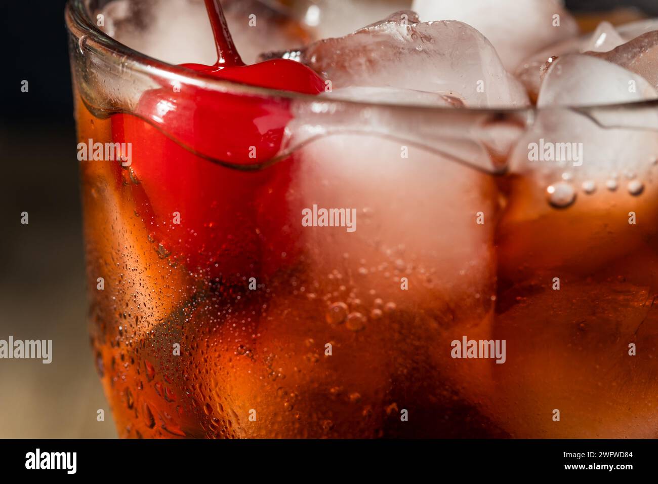 Cold Refreshing Cherry Cola with Ice in a Glass Stock Photo - Alamy