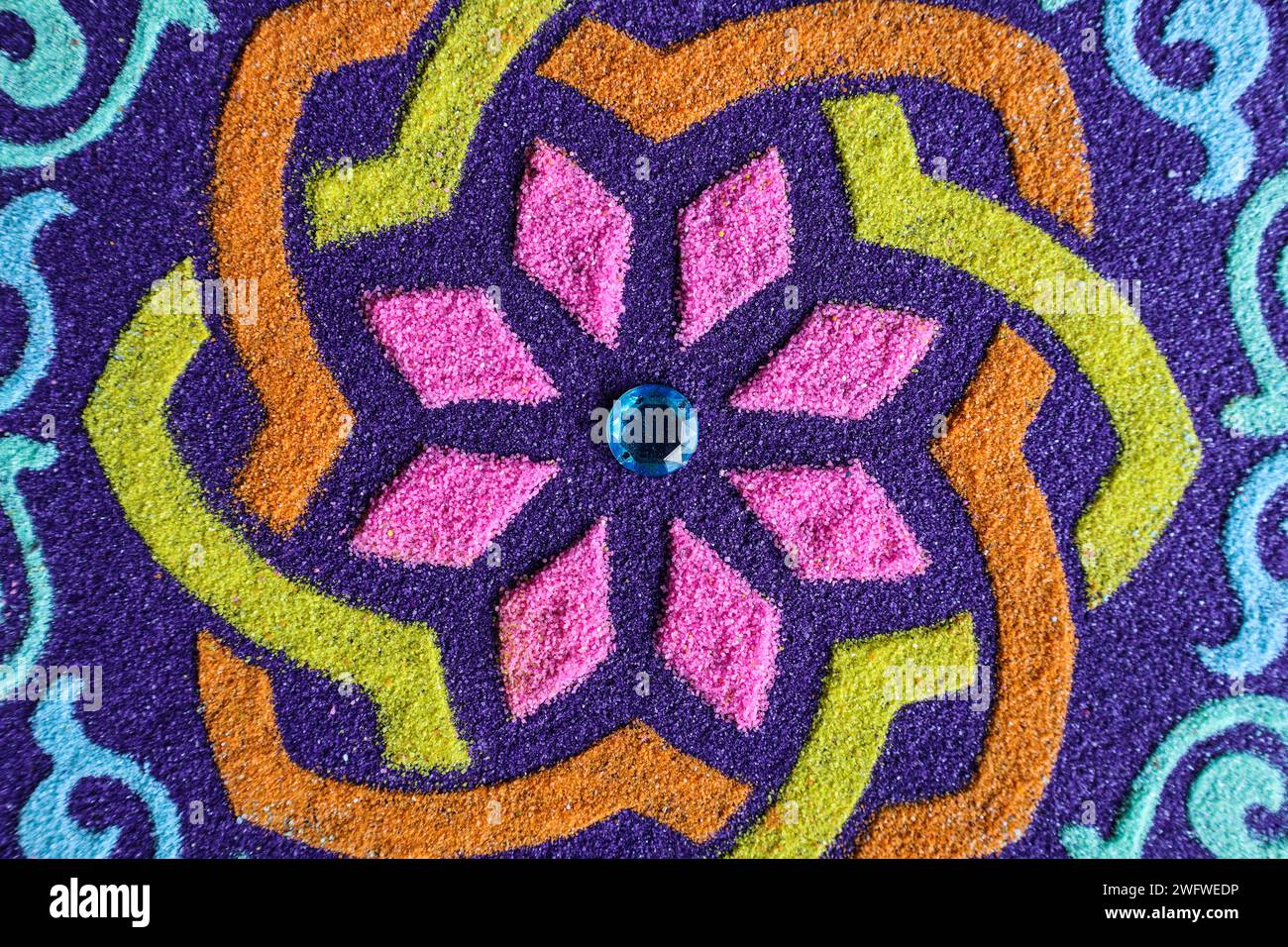Beautiful and colourful Rangoli backdrop. Designer pattern of sand art ...