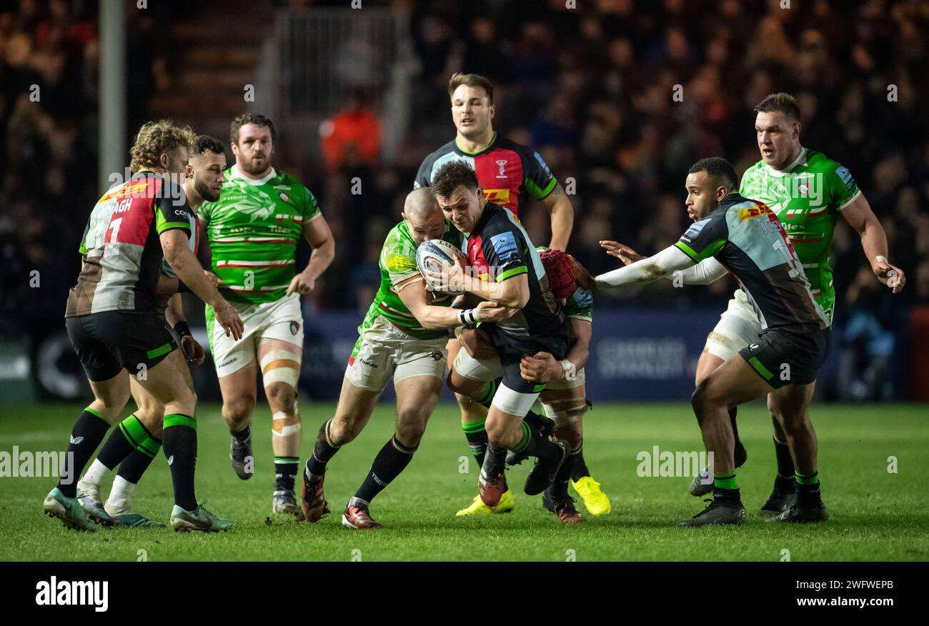 Harlequins Jarrod Evans and Leicester Tigers Mike Brown in action ...