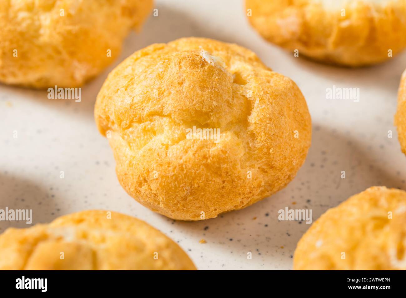 French Homemade Mini Cream Puff with whipped Filling Stock Photo - Alamy