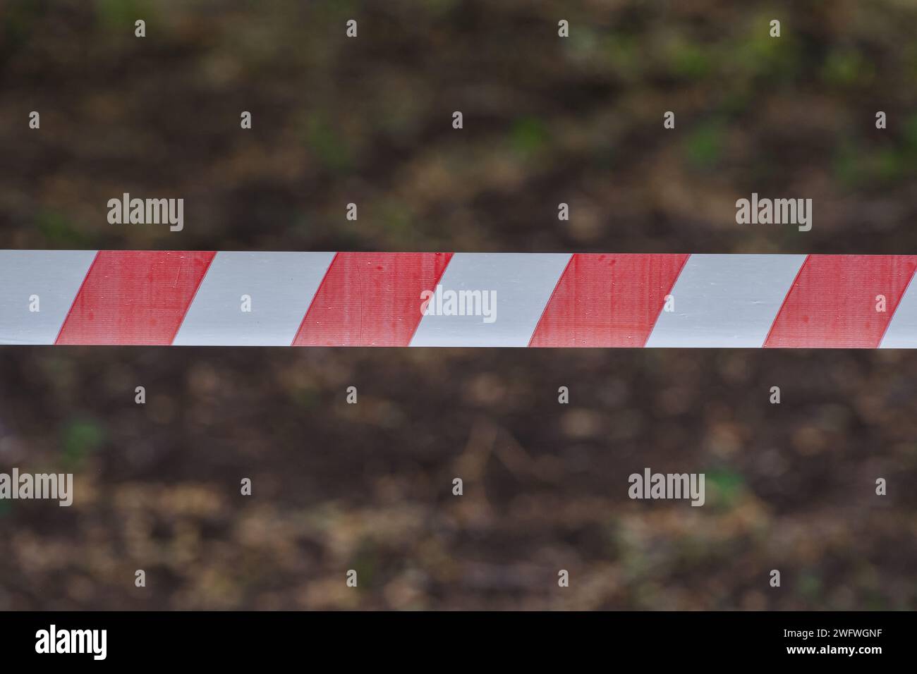 Caution Tape Across Park Pathway Stock Photo - Alamy