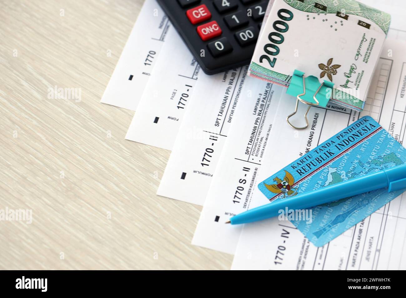 Annual Individual Income Tax Return forms with pen and indonesian ...