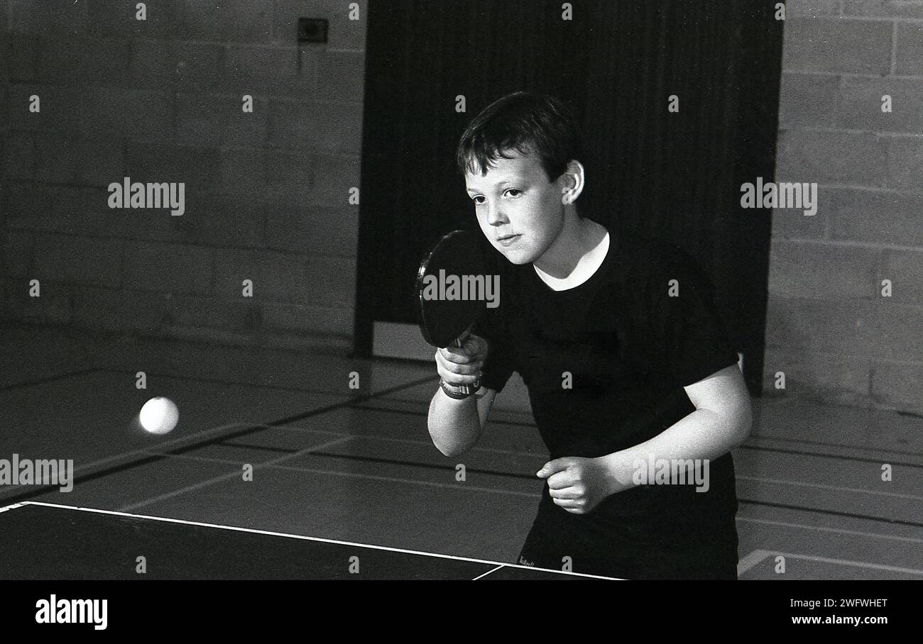 1987, inside an area at a sports centre, a young boy playing table ...