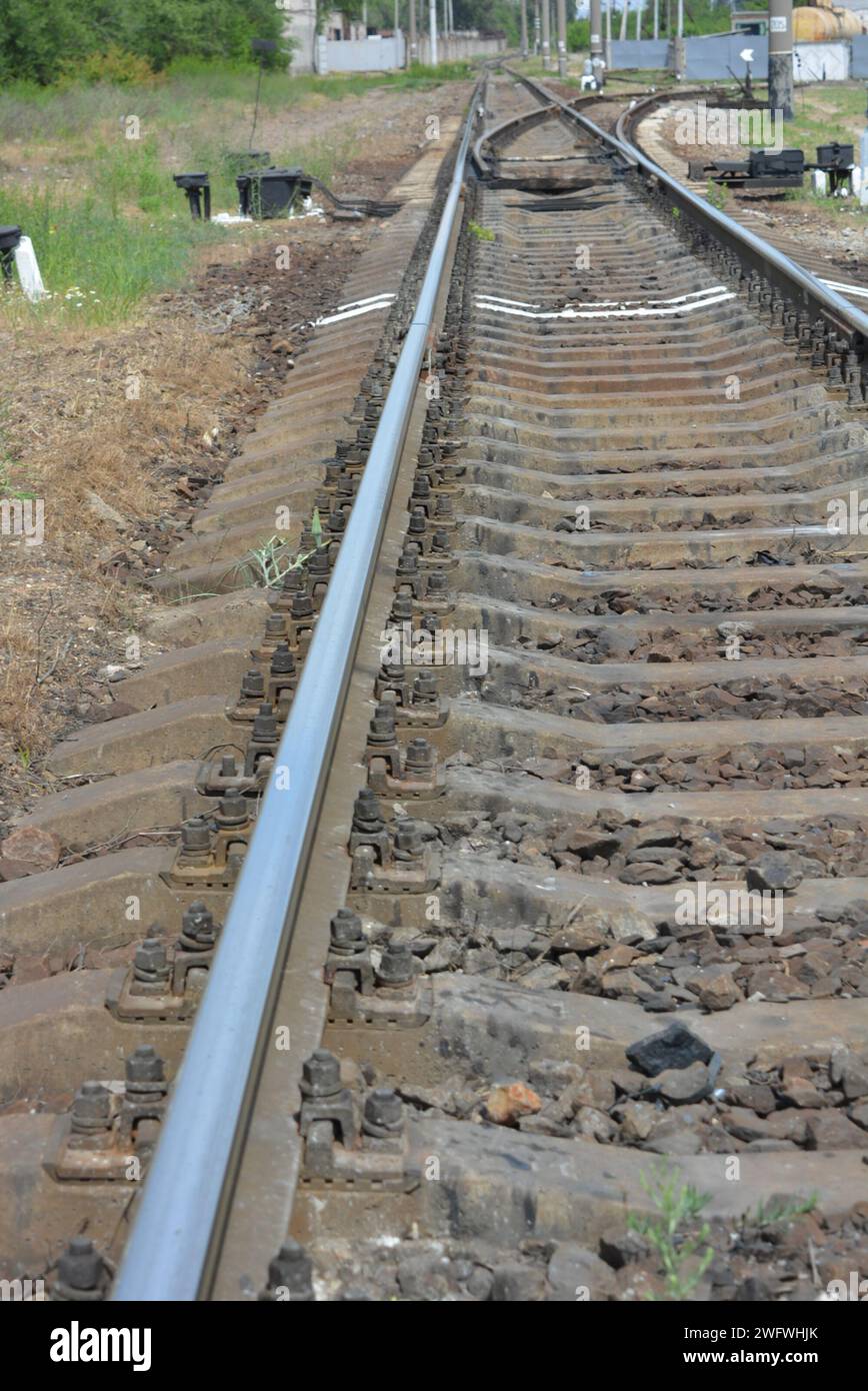 Railway tracks, electric lines, metal rails on which electric trains run, trains by Ukrainian ...