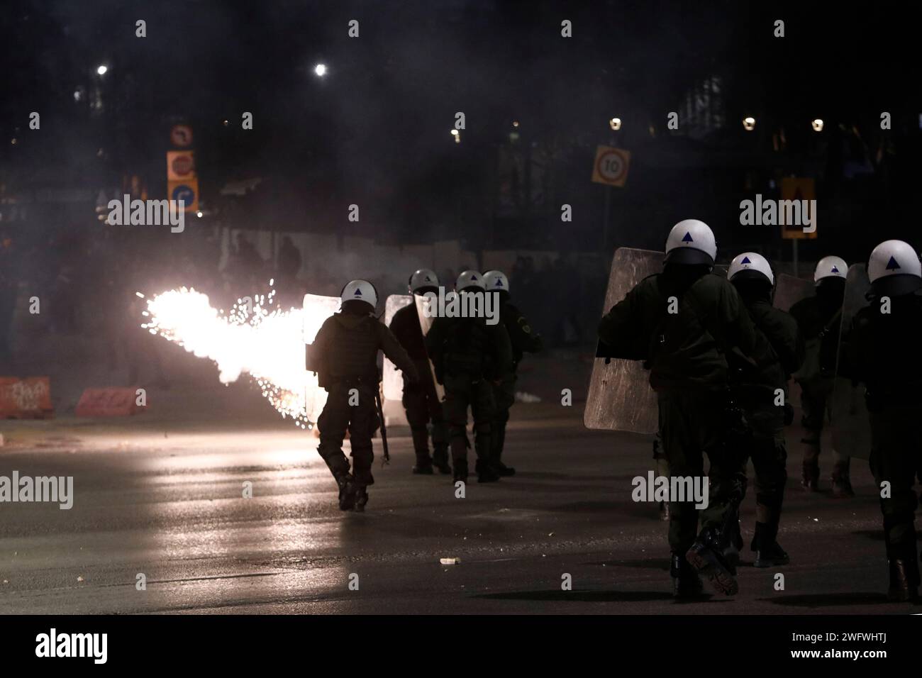 Riot police officers clash with protesters outside the public ...