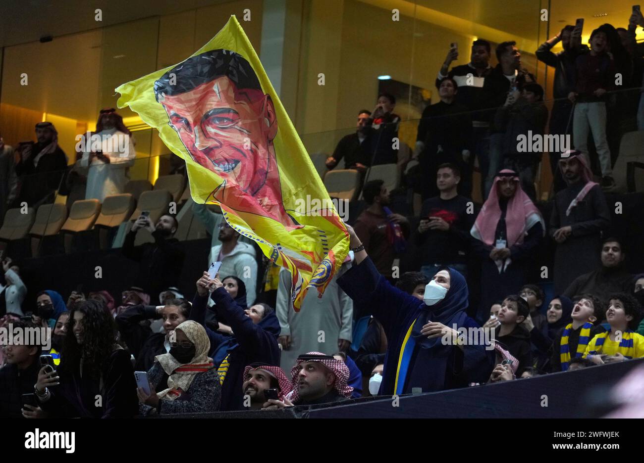 A Saudi soccer fan waves a flag with image of Al Nassr's Cristiano ...