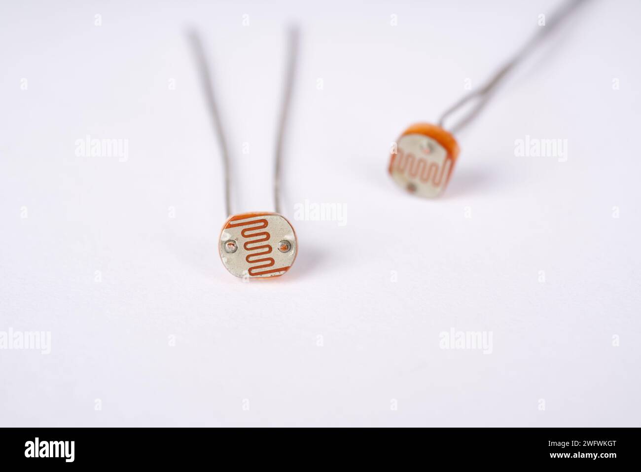 Electronic parts photoresistor on white background Stock Photo - Alamy