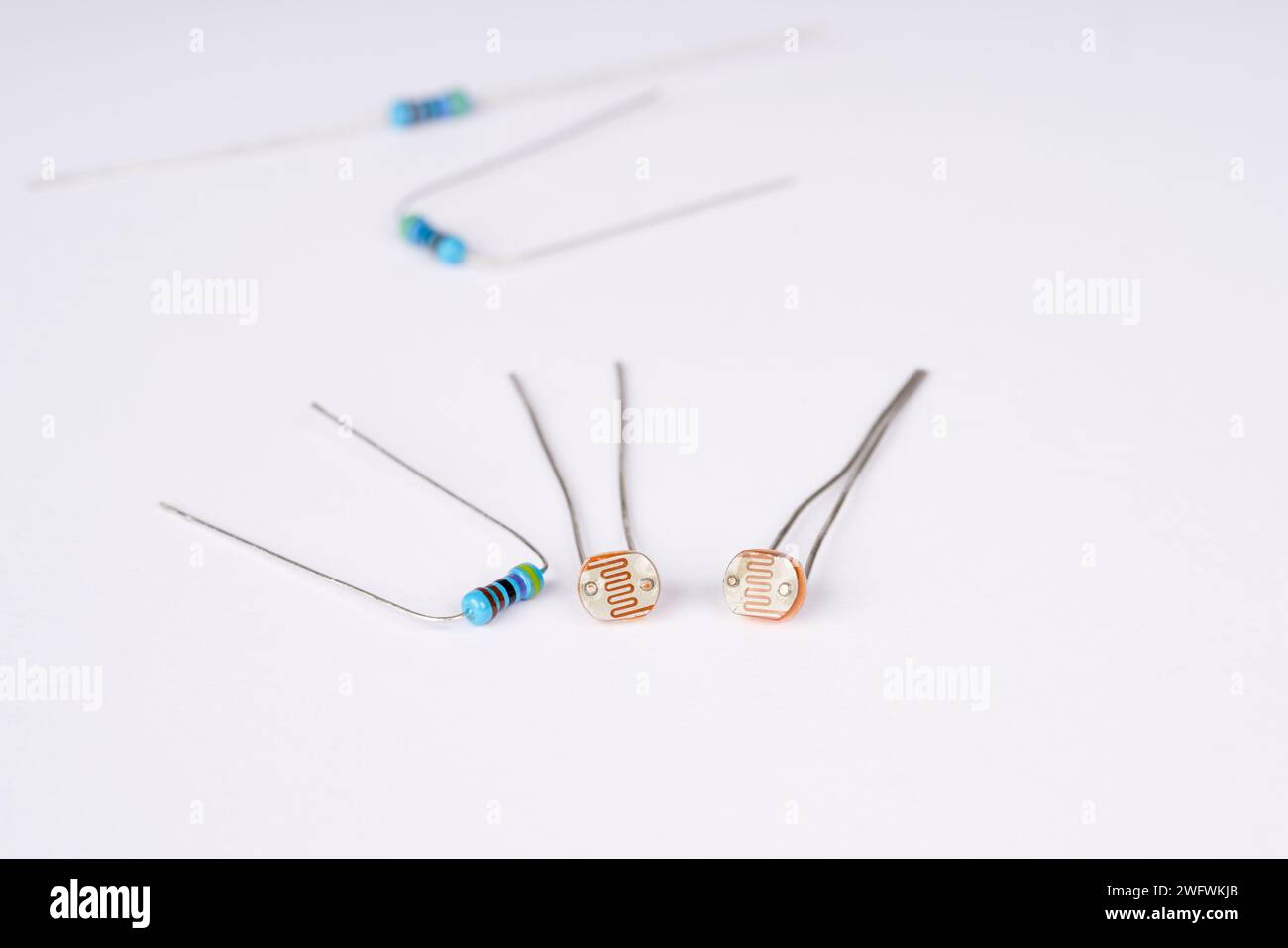 Electronic parts photoresistor on white background Stock Photo - Alamy