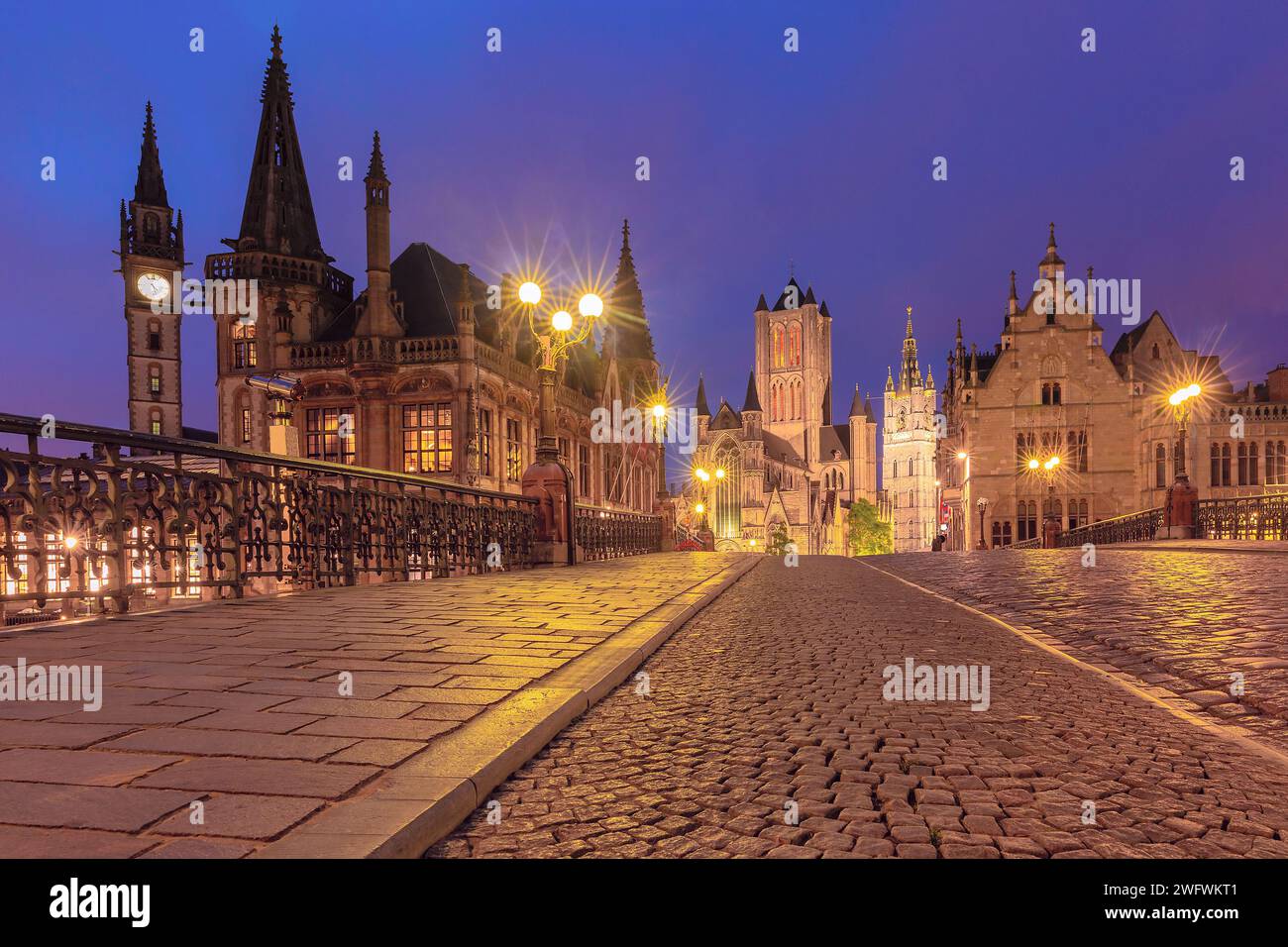 Picturesque medieval building and St Michael Bridge at night in Ghent ...