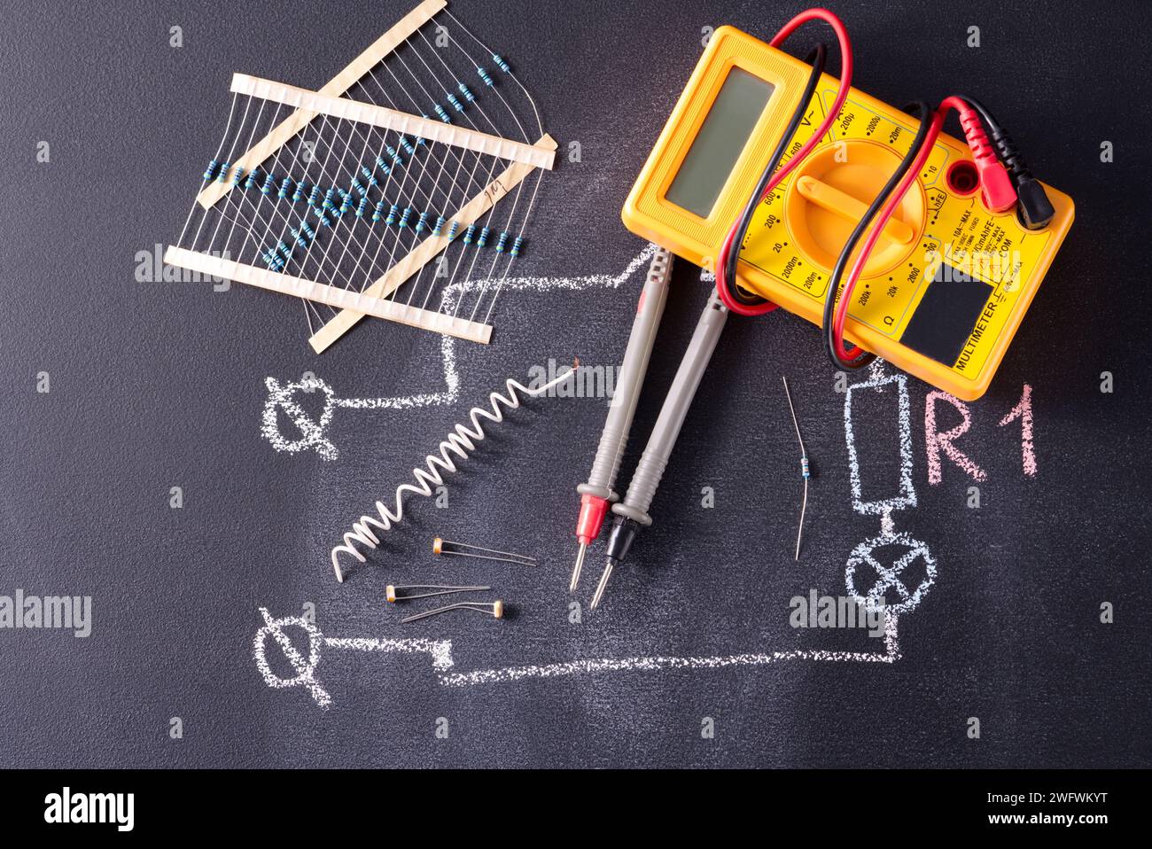 Electronic parts and multimeter dark background Stock Photo - Alamy
