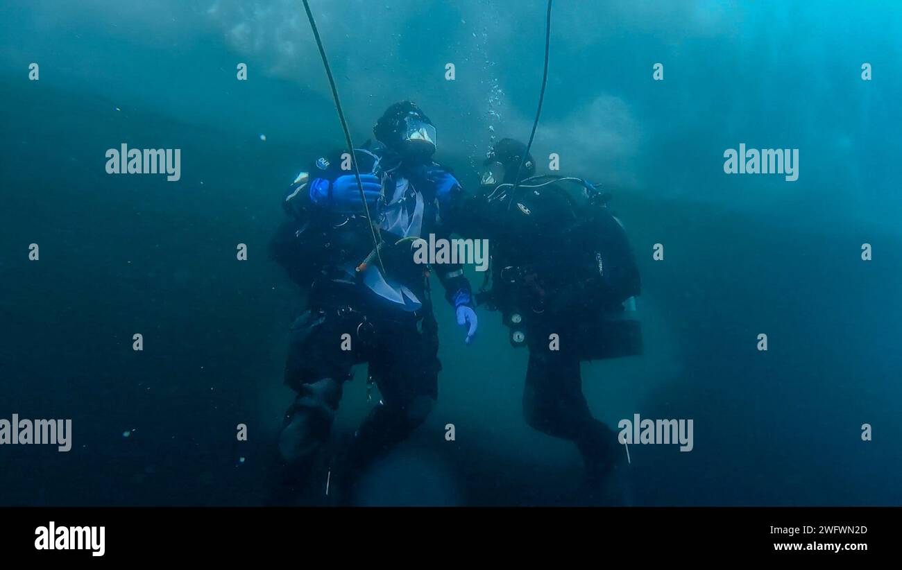 U.S. Coast Guard Petty Officer 1st Class Casey Connors, and Petty ...