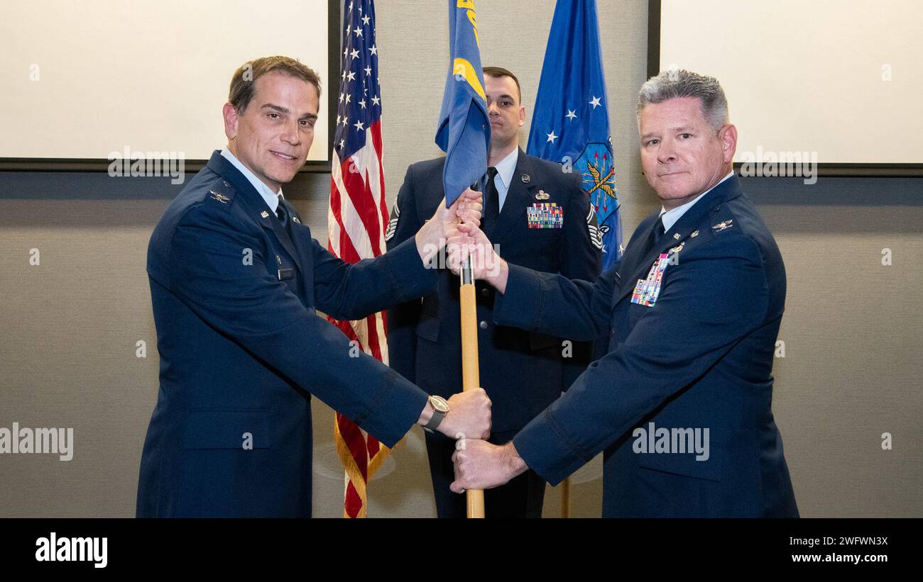 Col. Christopher Sedlacek, 302nd Airlift Wing commander, passes the ...