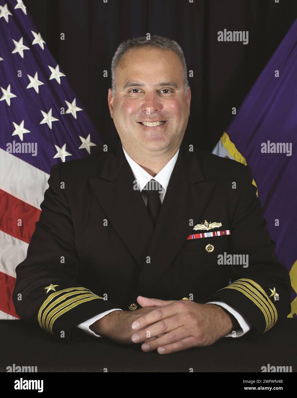 Capt. Stockton enlisted in the U.S. Navy as a Cryptologist in 1990 ...