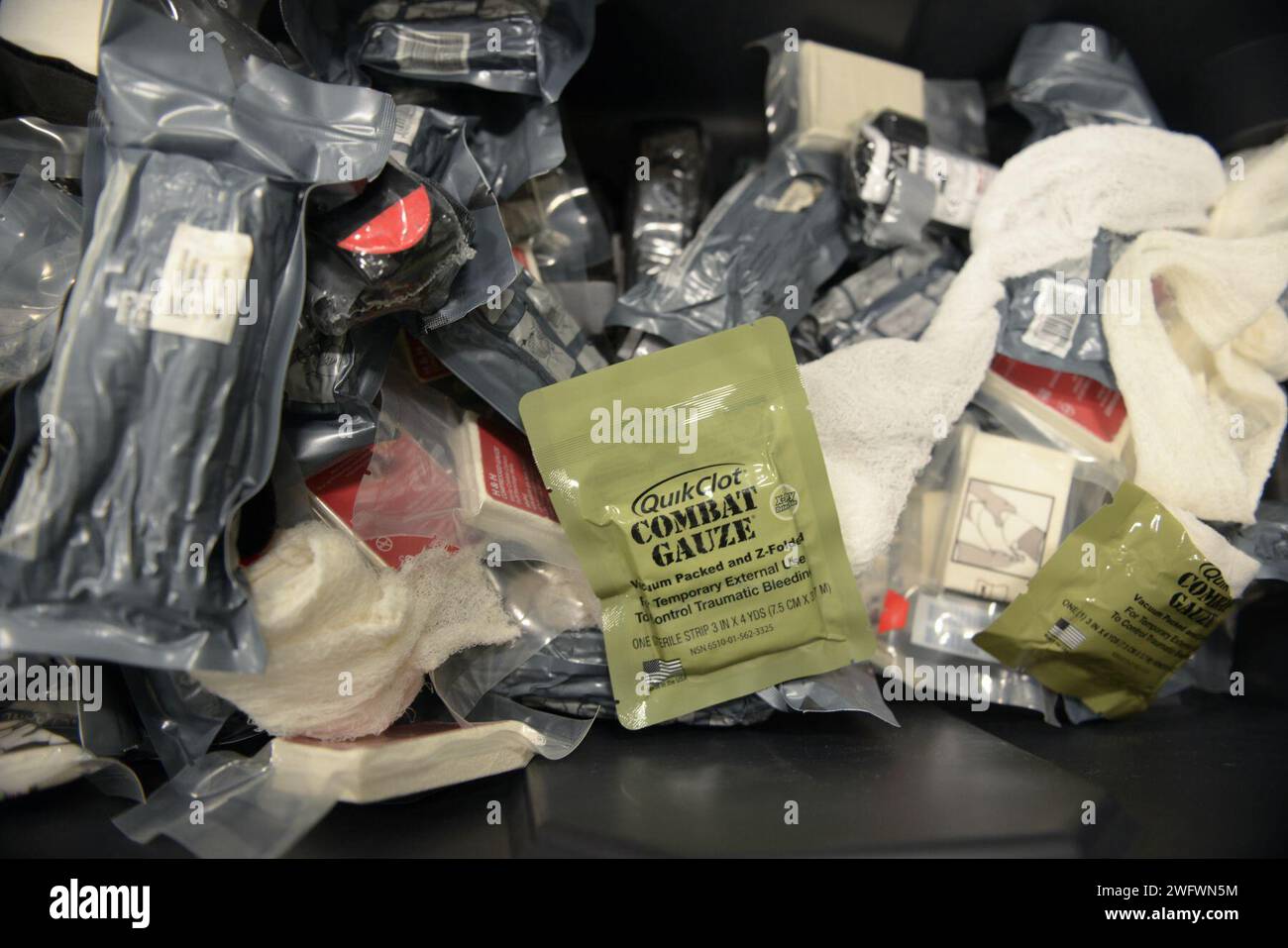 Miscellaneous medical supplies stacked in a box at the 38th Infantry ...
