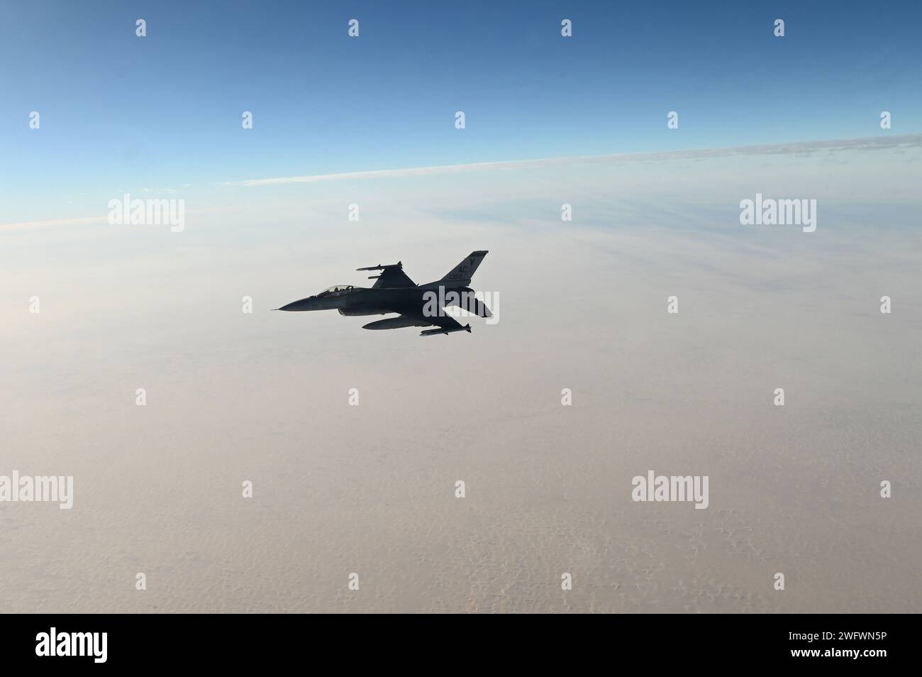 A U.S. Air Force F-16 Fighting Falcon prepares for an aerial refueling ...