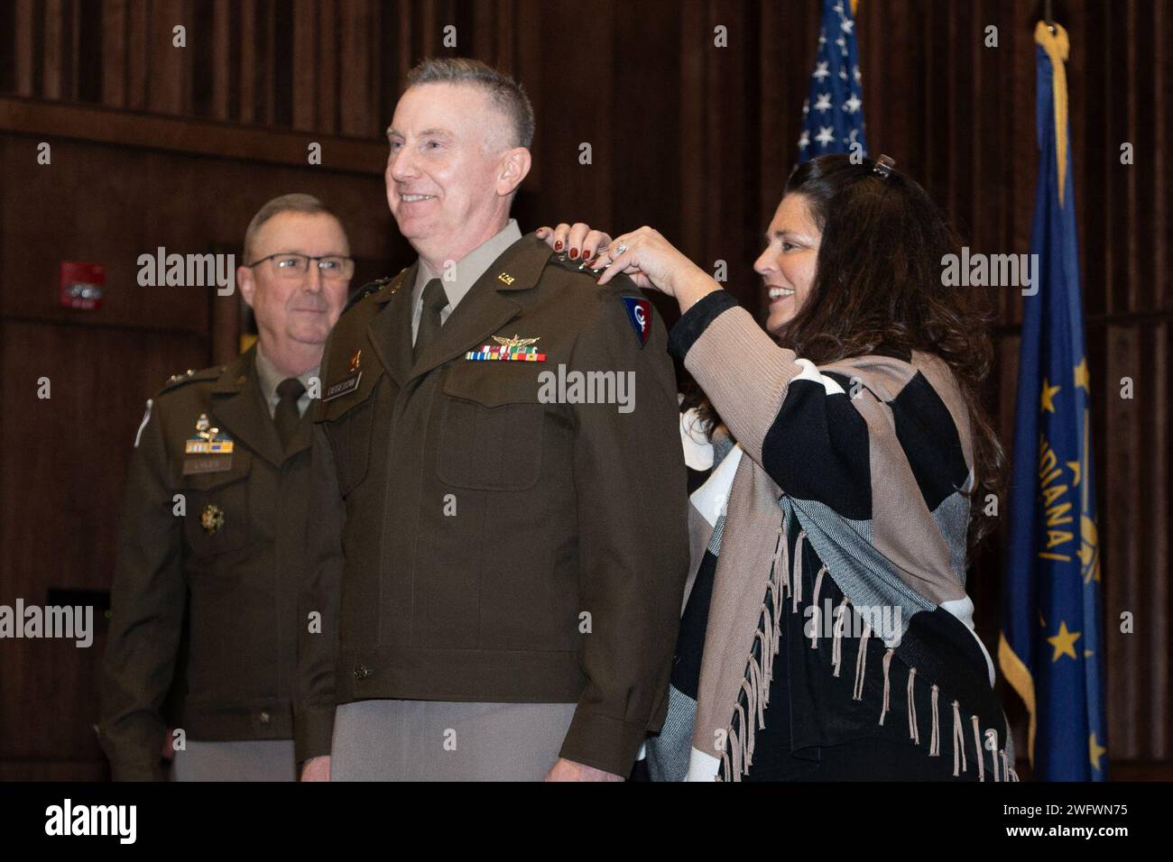 Indiana National Guard Maj. Gen. Dan Degelow, center, receives his two ...