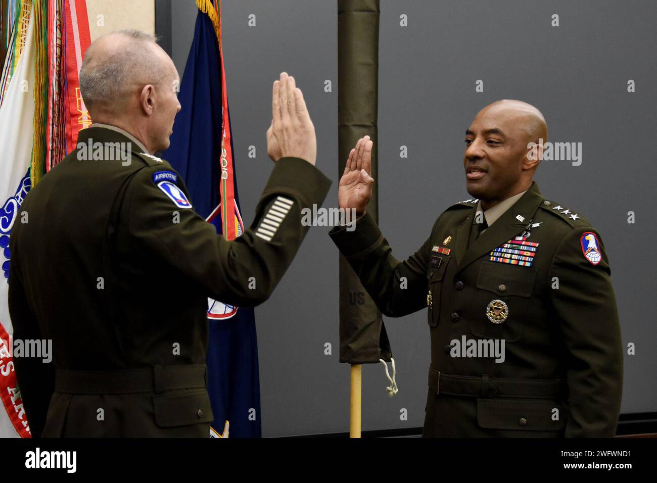 Gen. Randy George, U.S. Army chief of staff, left, administers the oath ...